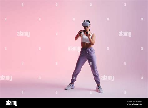 Enjoying A Virtual Reality Game Happy Young Woman Smiling Cheerfully While Playing A 3d Game