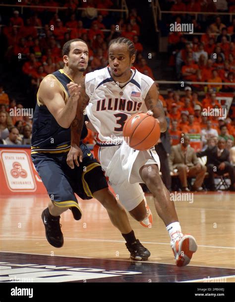 Illinois Chester Frazier 3 Tries To Dribble Past Michigans Jerret Smith Left During The