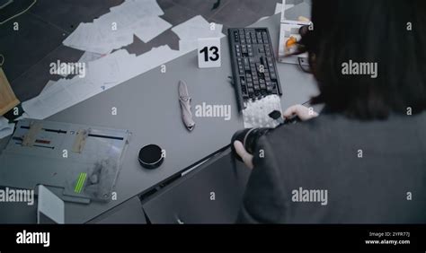 Robbery Or Murder Case Top View On Female Criminalist Taking Photos Of