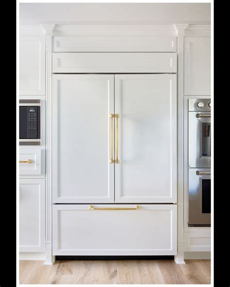 Elegant Panel Ready Sub Zero Fridge With Custom Cabinetry And Wolf