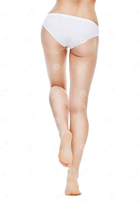 Beautiful Female Legs With White Panties On White Background Stock
