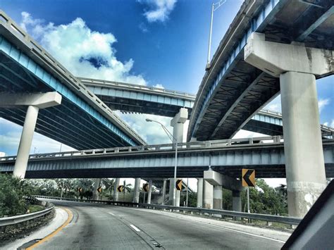 Passengers Survive After Their Car Crashes Off Of A Miami Overpass Onto