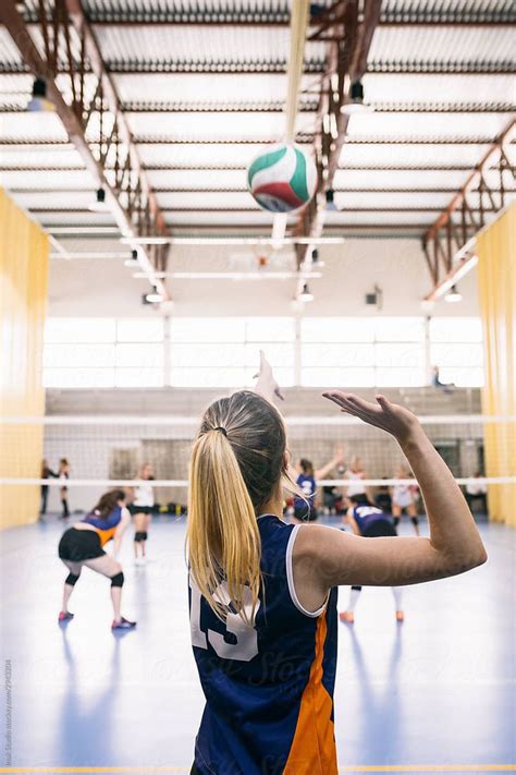 Competitive Female Volleyball Player Serving Ball While Tournament In