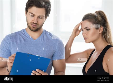 Personal Fitness Instructor Writing Individual Training And Diet Plan