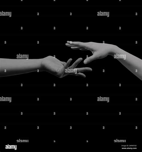 A Scenic Shot Of Hands Trying To Reach Each Other Isolated On The Black