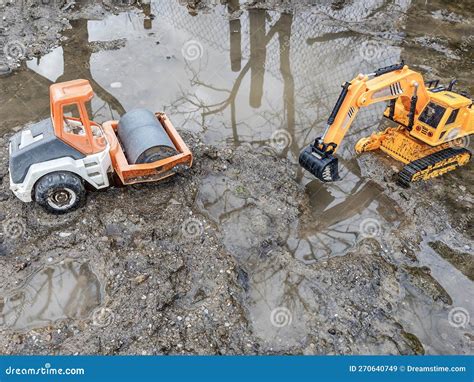 Excavator And Compactor Are On A Large Pile Of Soil Royalty Free Stock