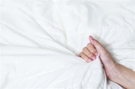 Premium Photo Hand Of Female Sex Intimacy Pulling White Bedsheet In
