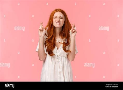 Eager And Tempting Cute Nervous Redhead Female Want Something Badly Making Wish With Fingers