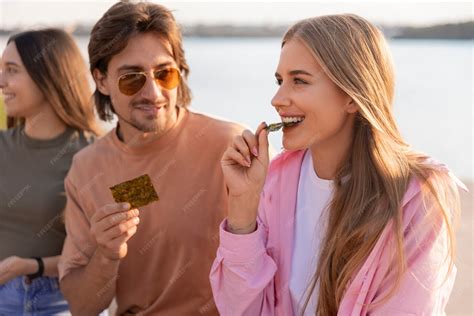 Free Photo Medium Shot Friends Eating Seaweed Snacks