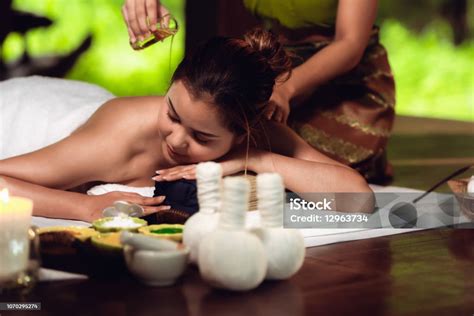 Portrait Of Asian Woman Is Relaxing In Spa Massage Thai Massage Stock