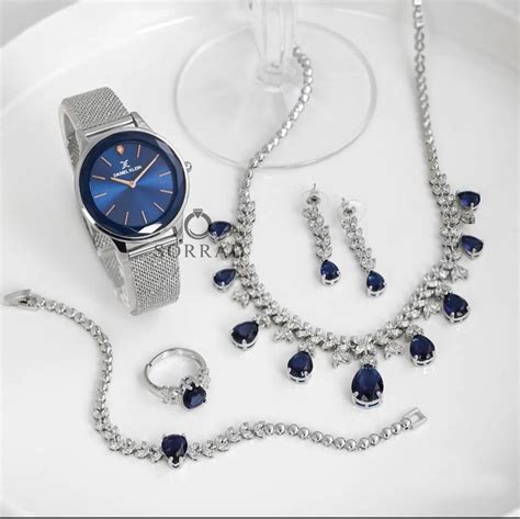 ساعت دنیل کلین زنانه ساده بند استیل حصیری رنگ سیلور صفحه سرمه ای