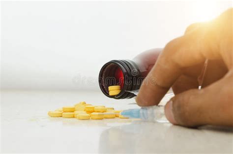 Closeup Of High Dose Medicine Or Medication Spilling From Bottle Stock