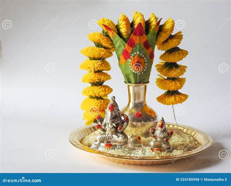Closeup Of Silver Kalash Decorated With Chrysanthemum Flower Leaf