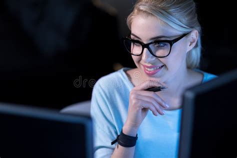 Smiling Programmer Looking Happy While Touching Visual Elements On The