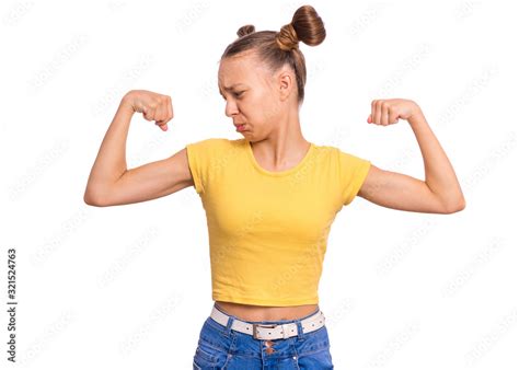 Portrait Of Funny Teen Girl Raised Her Hands And Shows Biceps Isolated On White Background Sad