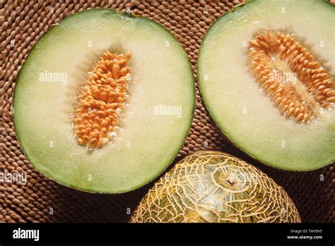 Galia Melon Cucumis Melo Cut Section Showing Flesh And Seeds Stock