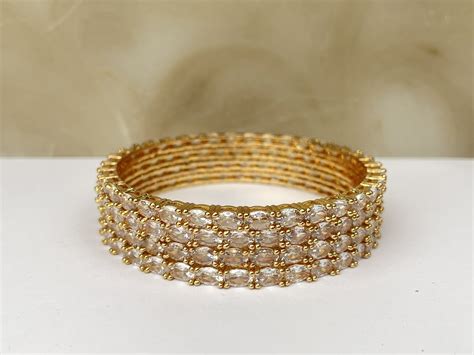 American Diamond Thin Elongated Bright Gold And White Churi Set Chohan