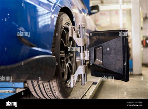 Car In Service With Sensors On The Wheels To Check Alignment Camber Toe