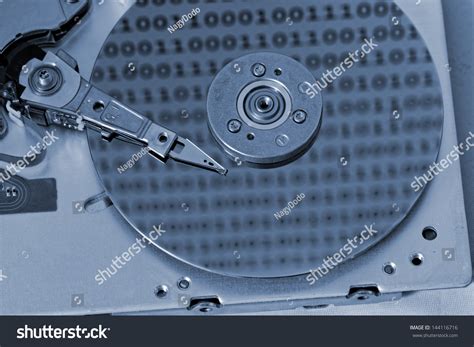 internals of a computer harddrive with binary number reflections with