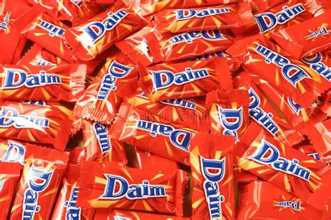 Daim Milk Chocolate And Caramel Candy On A Wooden Table Editorial