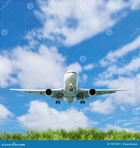 Airplane In The Sky With Beautiful Green Grass Blue Sky Scenery Stock