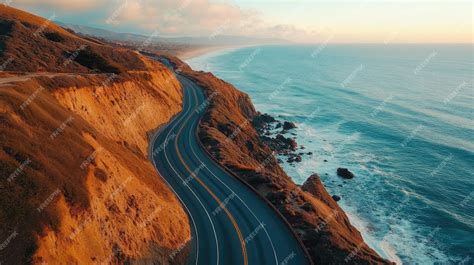 Aerial View Of An Empty Coastal Highway Along A Cliffside With The