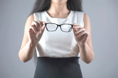 Premium Photo Woman Hand Glasses