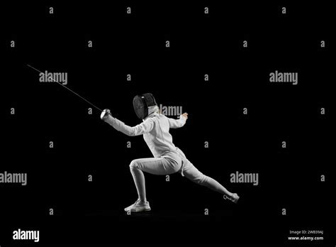 Fencers Footwork And Poised Stance In Mid Bout Against Pristine Black