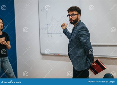 Educator Teaching Graph Analysis To Attentive Students In Classroom Stock Image Image Of