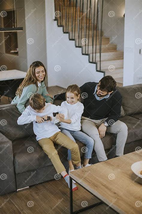 Siblings Fighting Over Tv Remote Control At Home Stock Image Image Of