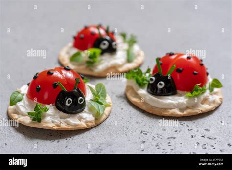 Lady Bug Cracker With Cream Cheese And Tomato For Summer Party Stock