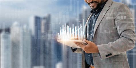 Indian Businessman Using Tablet Analysis Sales Data And Economic Growth
