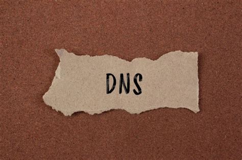 Premium Photo Dns Word Written On Ripped Paper Piece With Brown