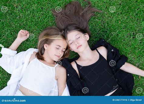 Fraternal Twins Sisters Blonde And Brunette Teen Girls In Fashionable