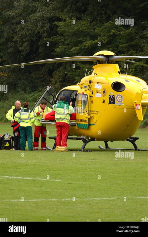 Air Ambulance Ec 135 Helicopter Loading A Sports Injury Casualty On A