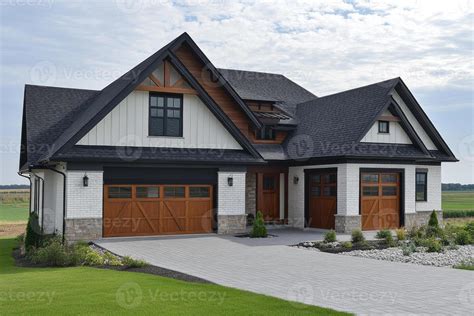 Beautiful Modern Farmhouse With Wooden Garage Doors And Asphalt