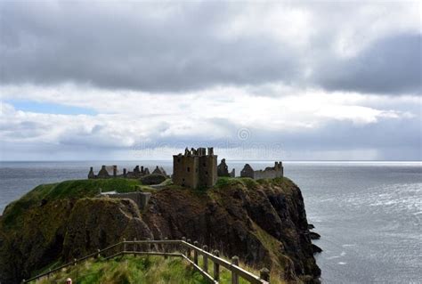 Sea Cliff Outcropping With Castle Ruins In Scotland Editorial Photo