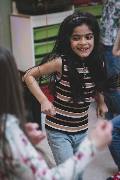 Premium Photo Cute Girl Dancing With Friends At Home