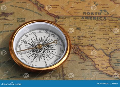 Classic Round Compass On Old Vintage Map Depicting North America And