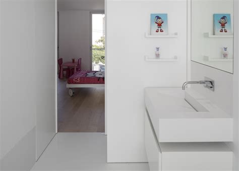 Hinged Shutters Camouflage With Facade Of Townhouse By Humberto Conde