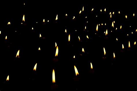 Premium Photo Lit Candles At Night