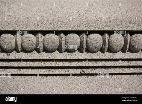 A Repeating Dot Dash Pattern Carved Into The Natural Stone Surface