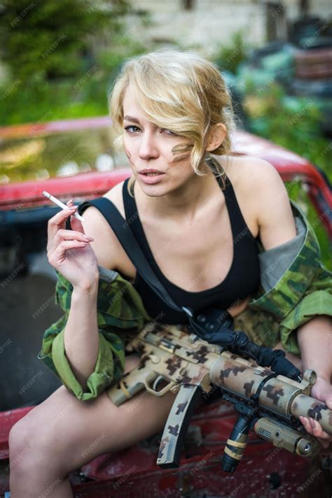 Premium Photo Beautiful Portrait Of A Girl Holding A Gun
