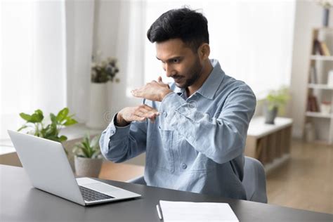 Focused Millennial Male Communicate Online With Person Having Hearing