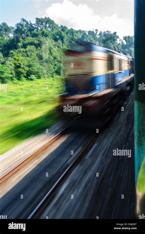 View Through Window Of A Speeding Train Passing Through Forest Stock