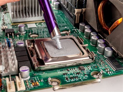 Application Of Thermal Paste From A Special Syringe To The CPU Cover Heat Conducting Paste