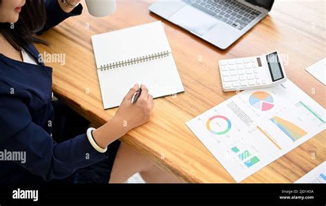 Overhead Shot Businesswoman Or Female Financial Worker Working At Her
