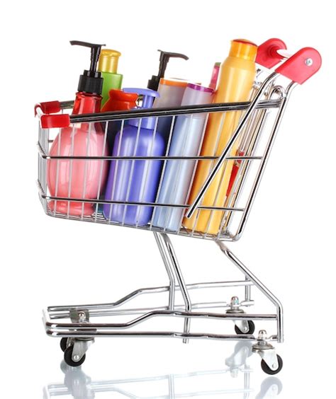 Premium Photo Shopping Cart With Detergent Bottles Isolated On White