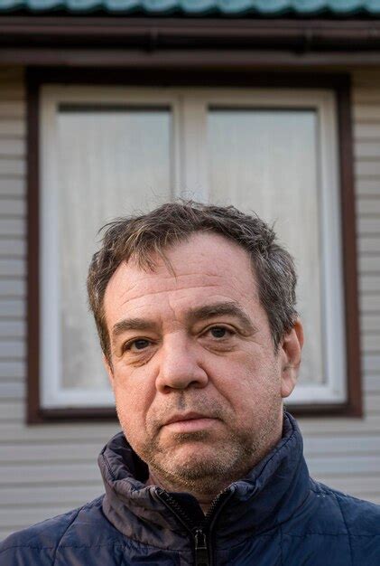 Premium Photo Adult Man In Front Of His House