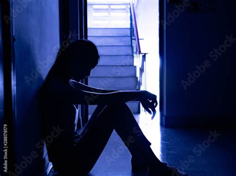 Sad Girl Sitting Against Wall Sad Girl Sitting Against Wall